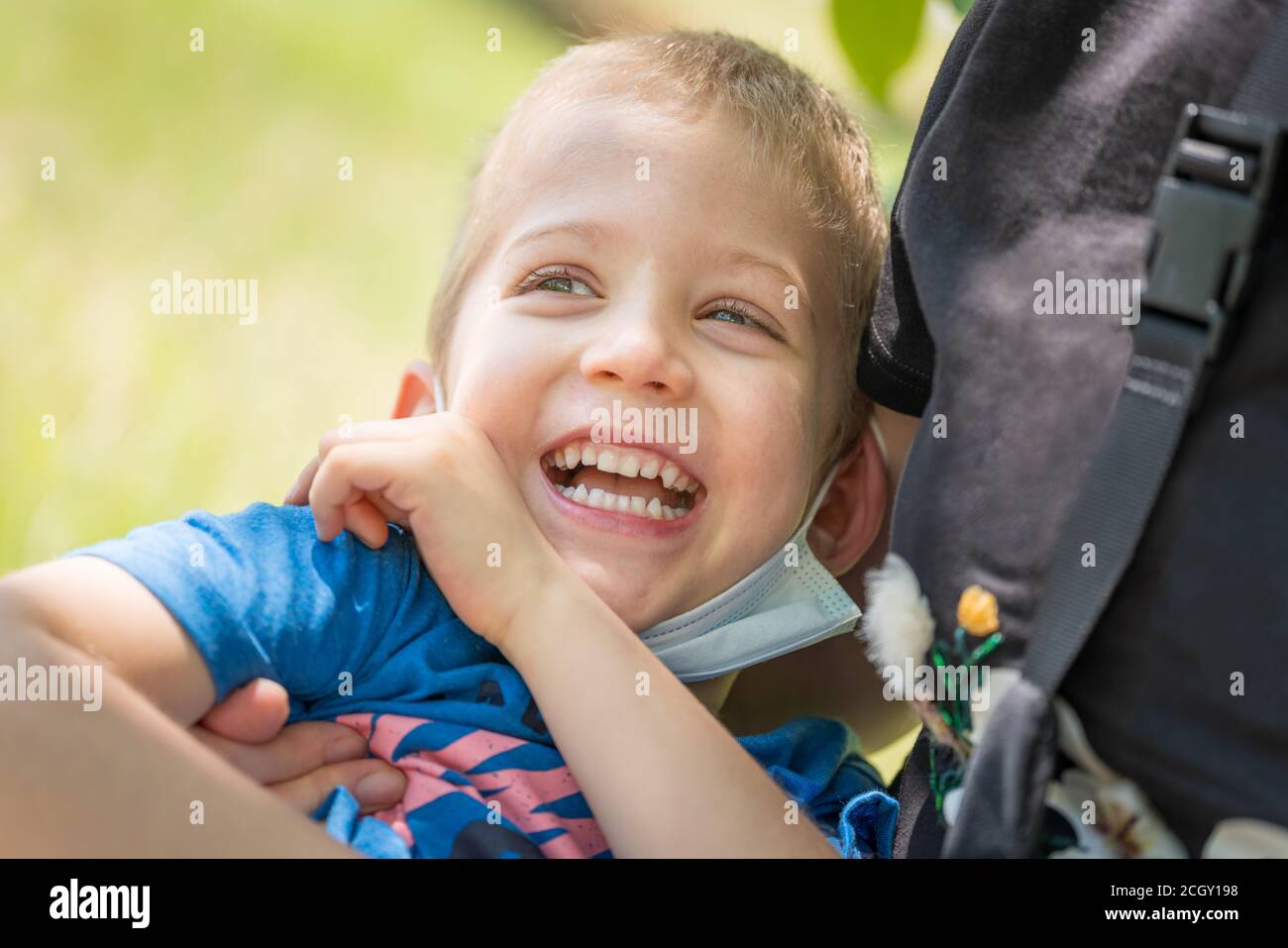 Close up portrait of cute little son hug cuddle laughing enjoying free ...