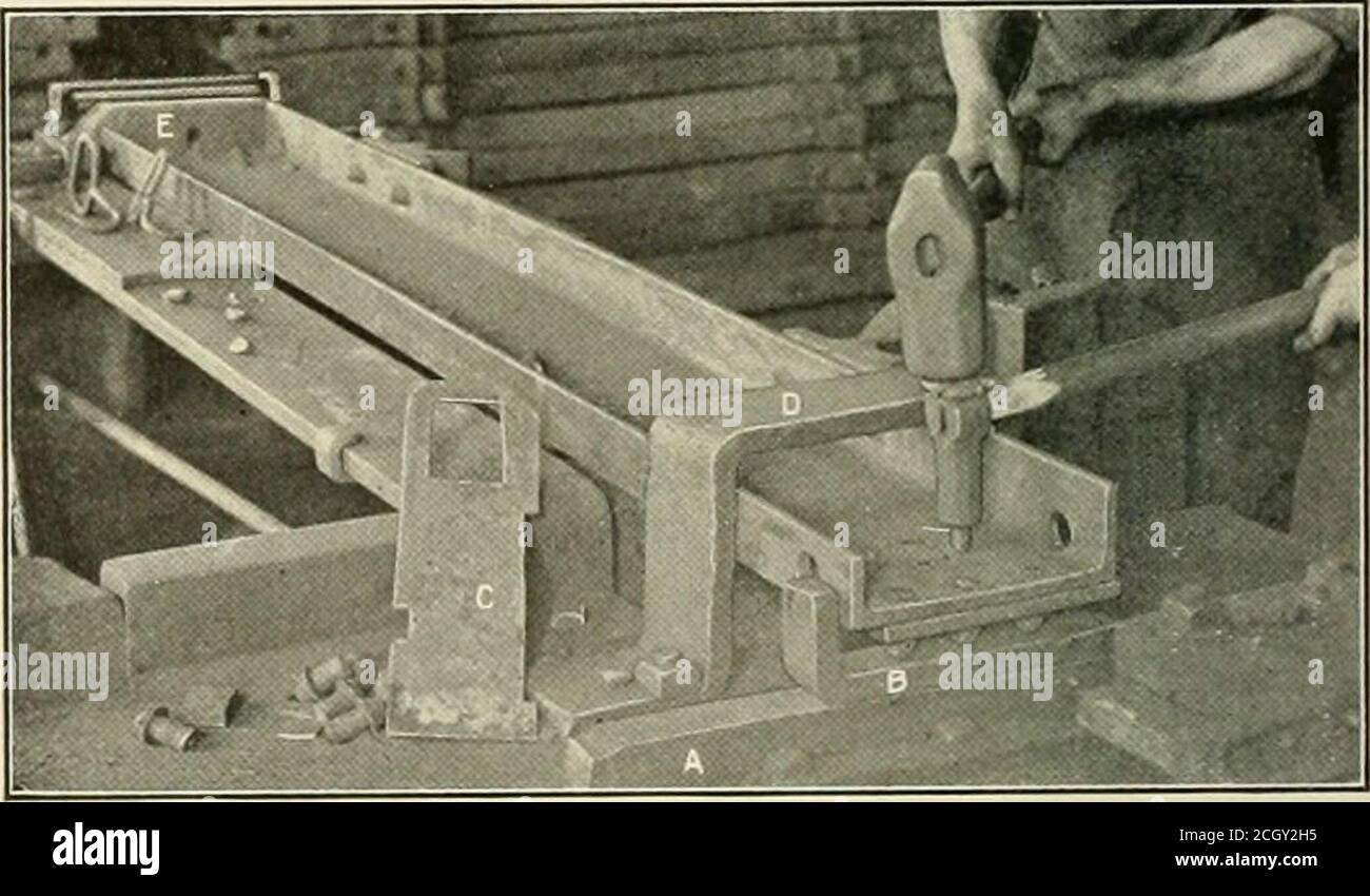 . Railway age gazette . Fig. 4—Bulldozer Equipped for Shearing Rivets ...