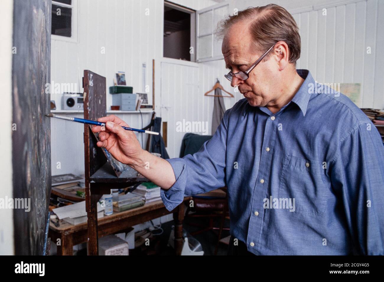 Charles Hardacre at work in his Fulham studio on a painting depicting ...