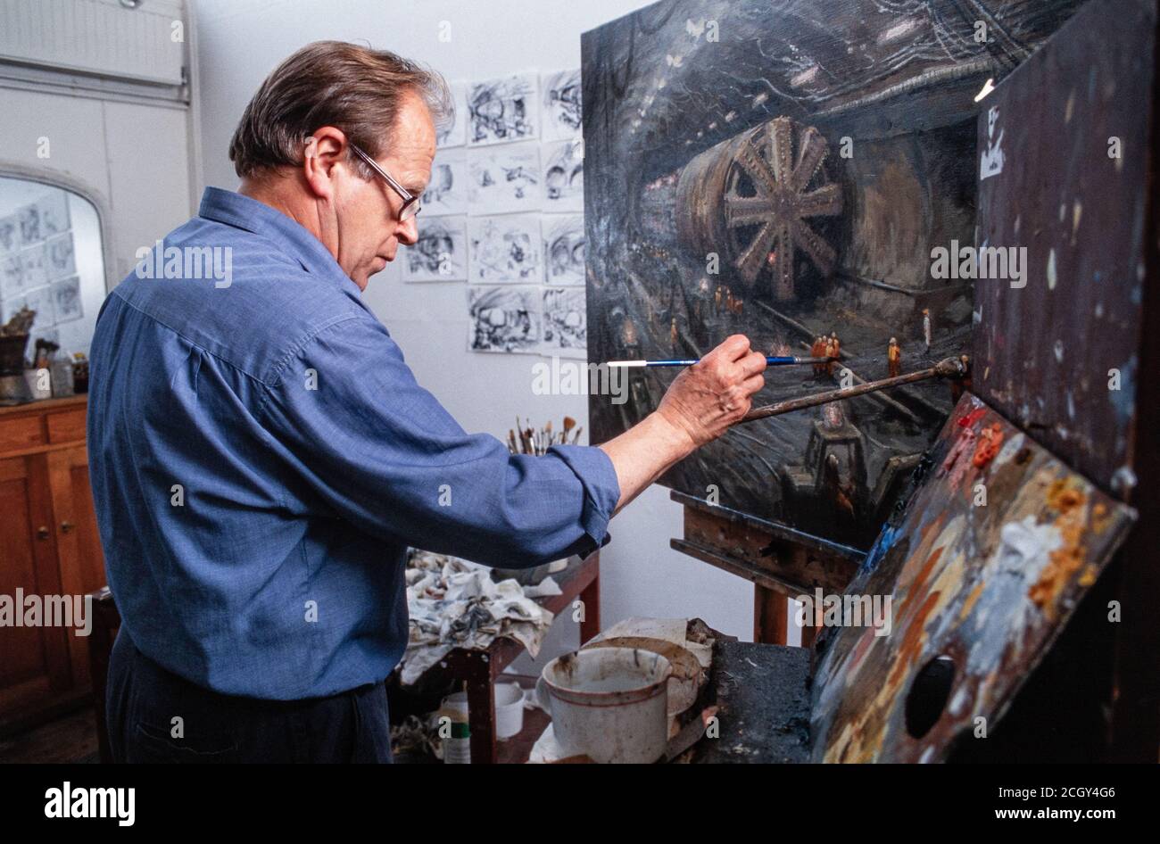 Charles Hardacre at work in his Fulham studio on a painting depicting ...