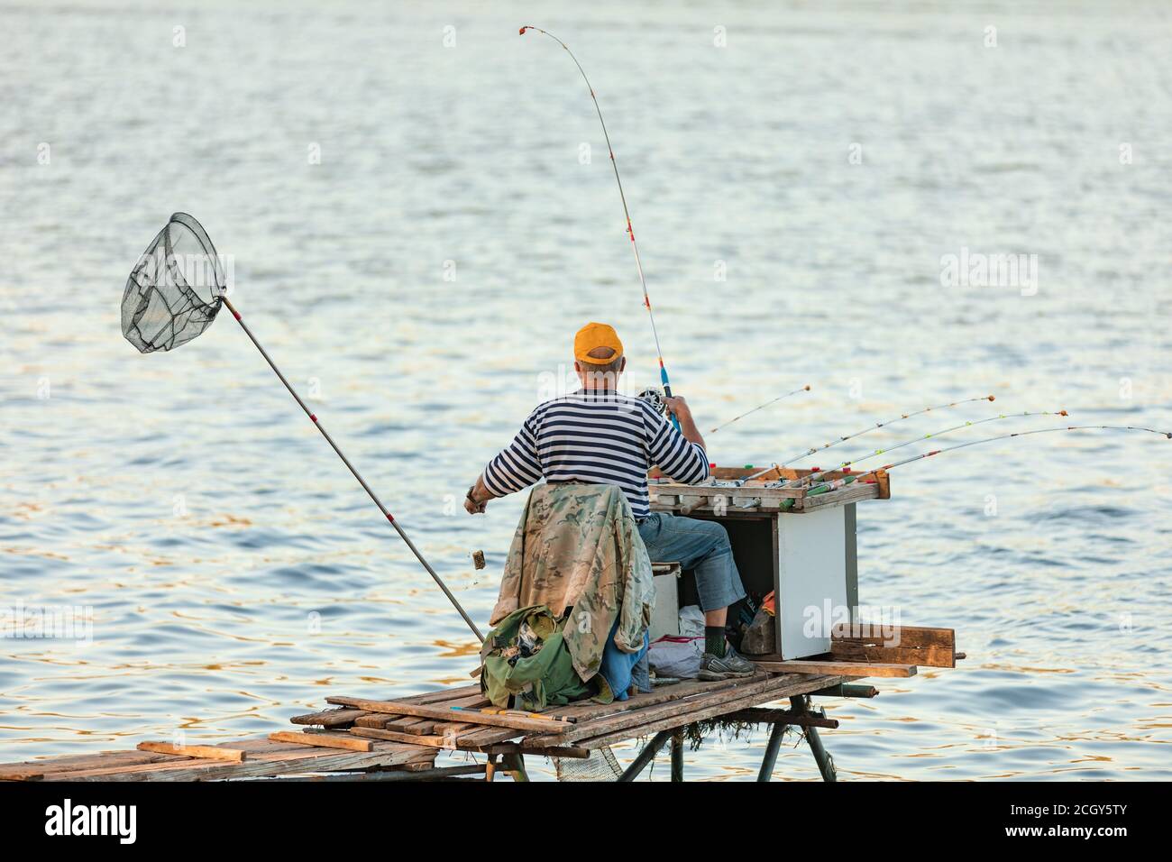 Back view person spin fishing hi-res stock photography and images - Alamy