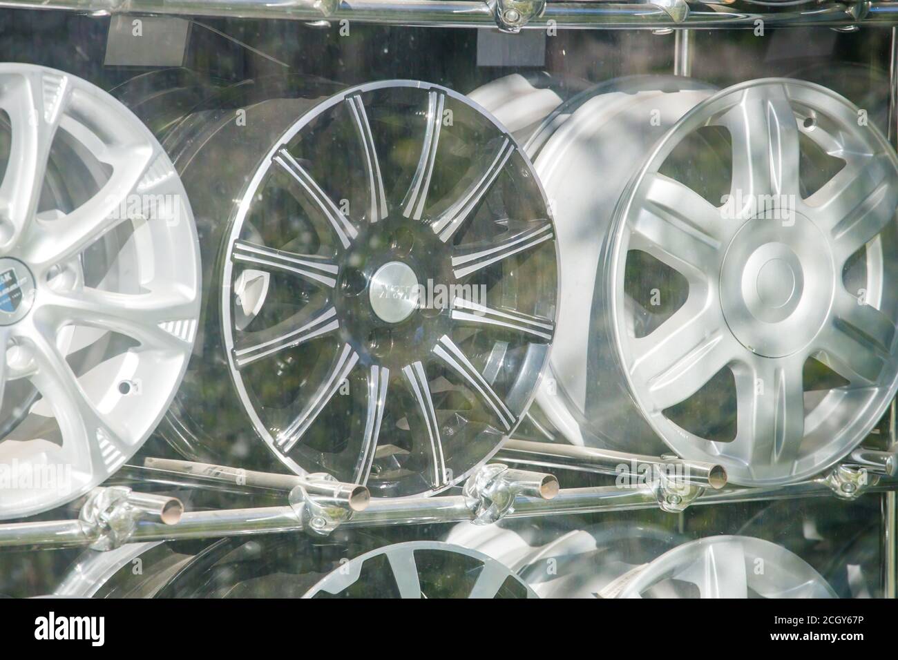 Russia Vyborg. 09.09.2020 Car rims in the shop window behind the glass ...
