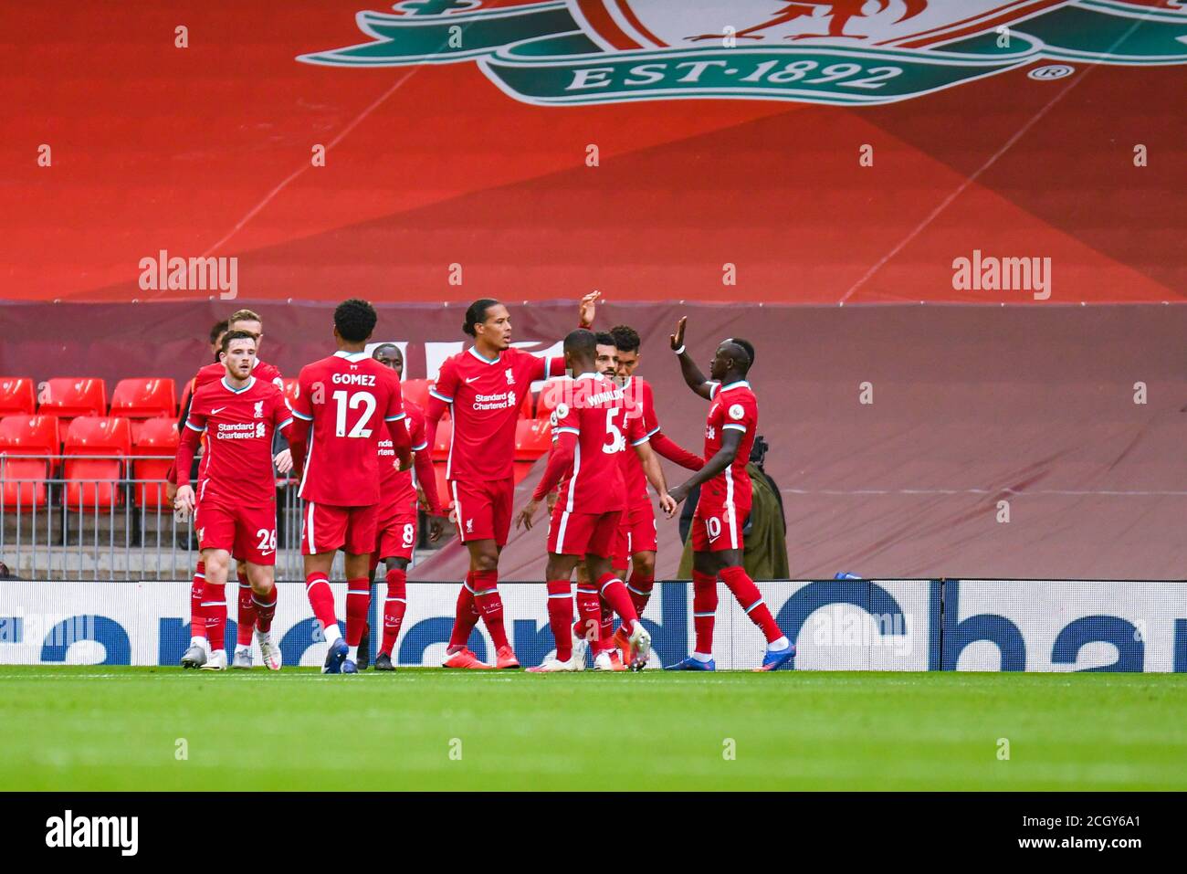 Liverpool defender Virgil van Dijk (4) scores a goal and celebrates to ...