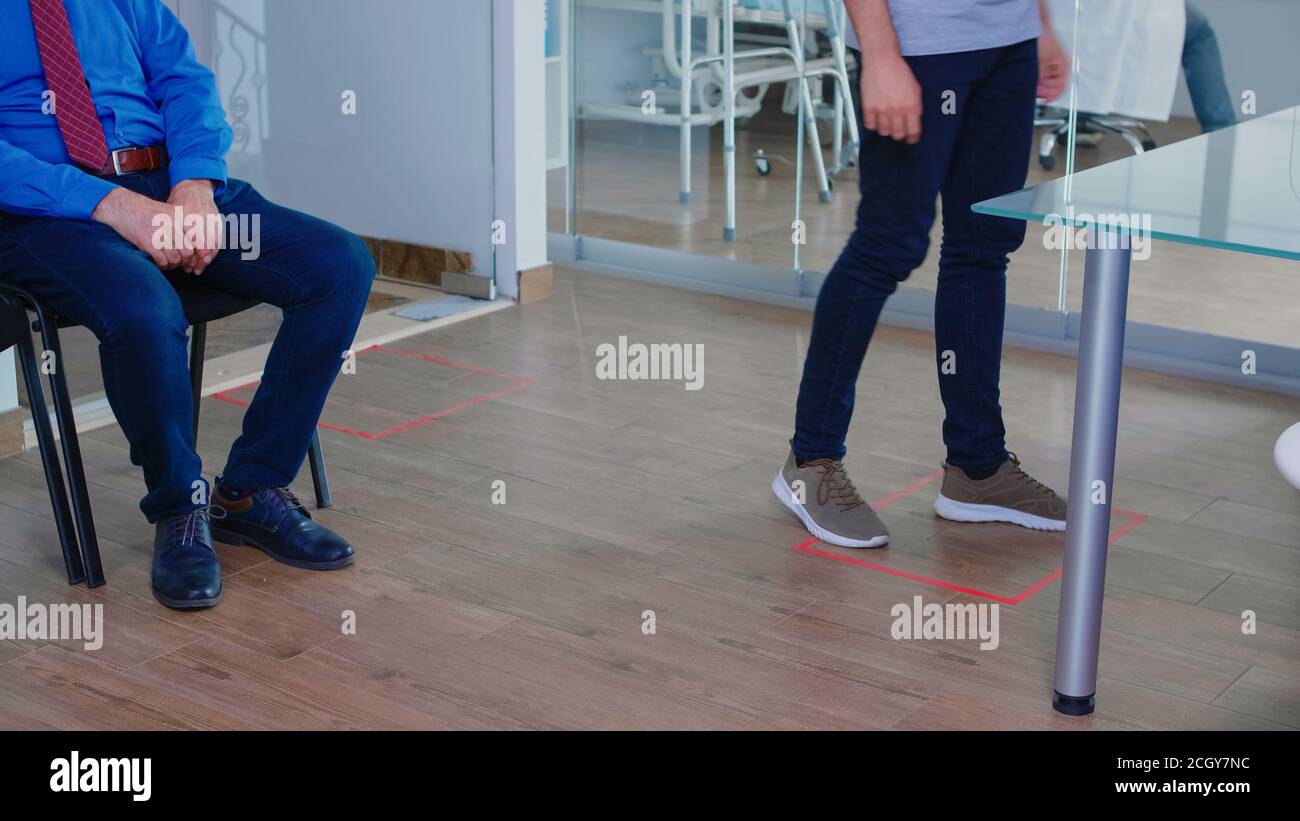 Hospital waiting area with covid-19 sticker for social distancing at ...