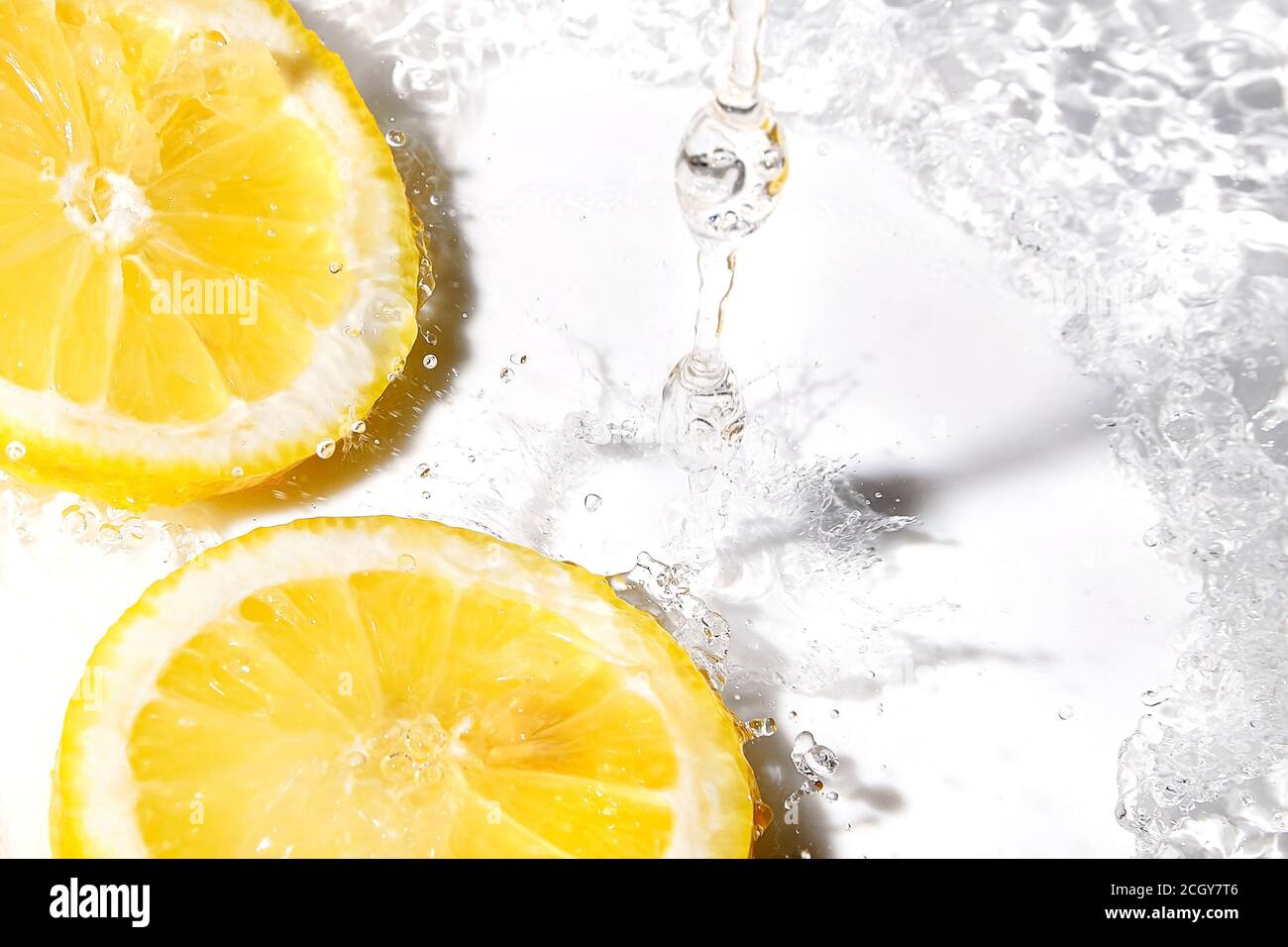Bright yellow fresh lemon slices and water splash. Tasty and healthy food Stock Photo - Alamy