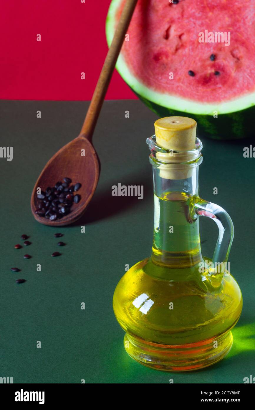 Watermelon seed oil in a glass jar Stock Photo - Alamy