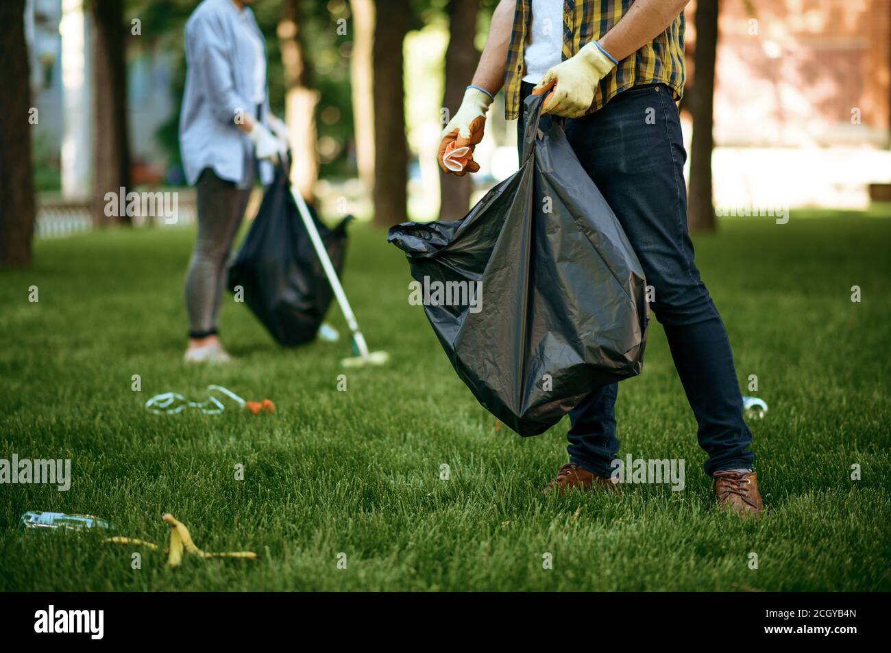 People collects garbage in bags, volunteerin Stock Photo - Alamy