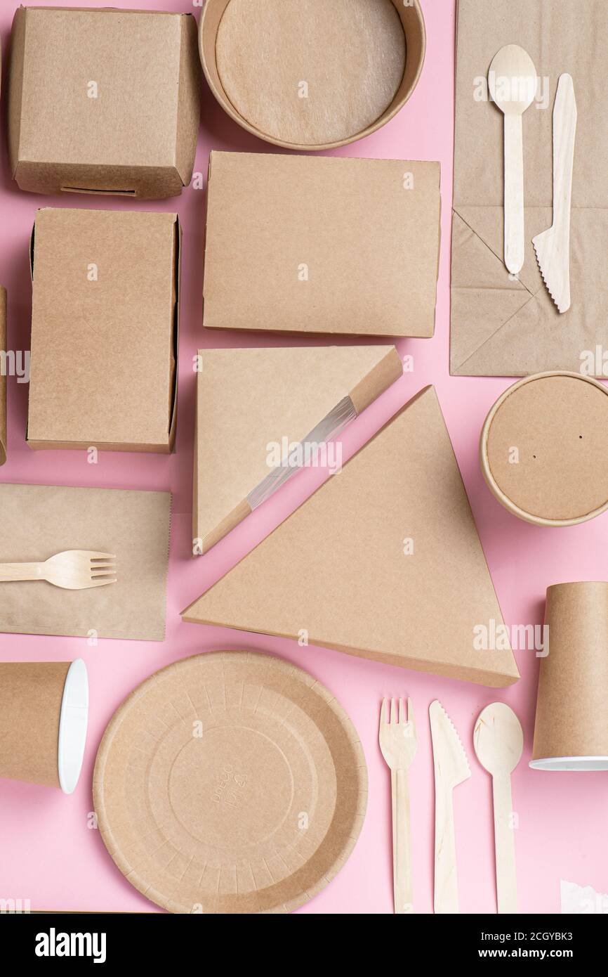 Stack of eco paper food containers placed closely together over pink ...