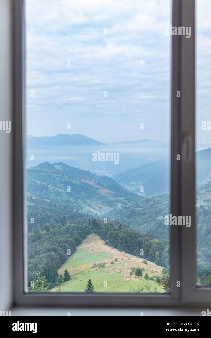 Open window view mountains hi-res stock photography and images - Alamy