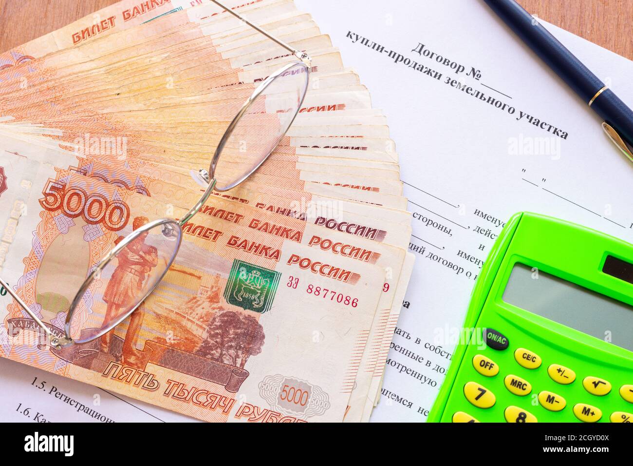 Signing a purchase and sale agreement for a land plot and payment Stock ...