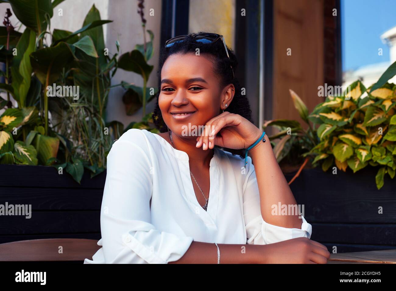 Young Pretty African Girl Posing Cheerful In Cafe Outdoor Lifestyle