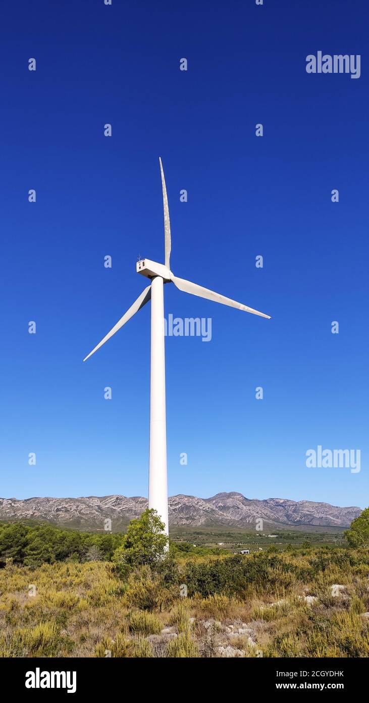 Stock photography of a large windmill in the mountain on a sunny day ...