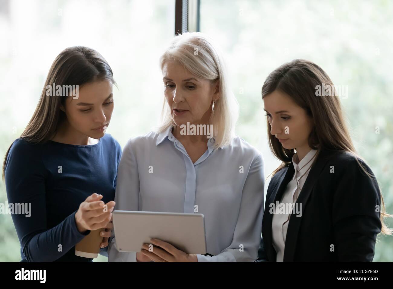 Diverse female colleagues cooperate hi-res stock photography and images ...