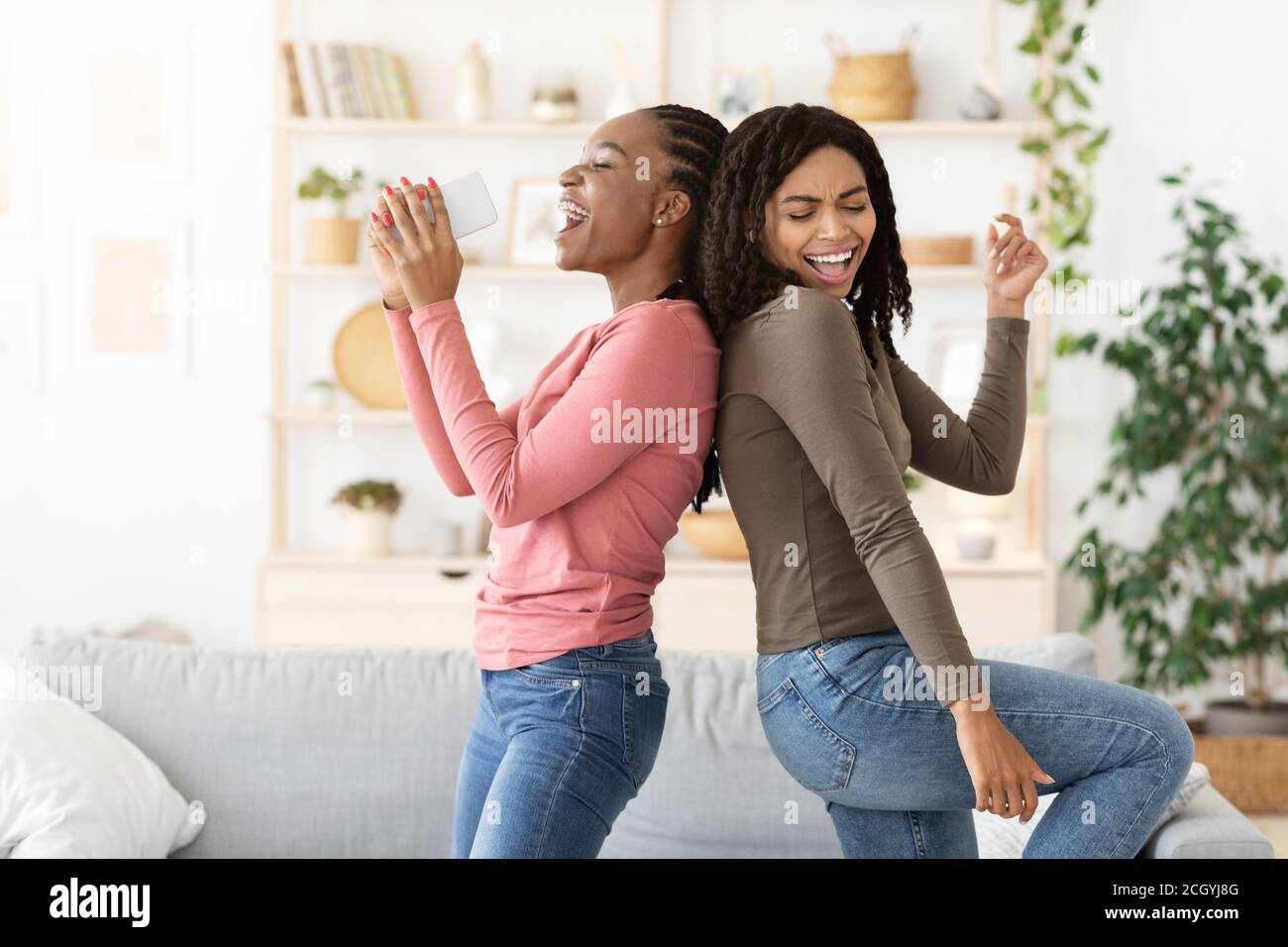 Two girls dancing together hi-res stock photography and images - Alamy