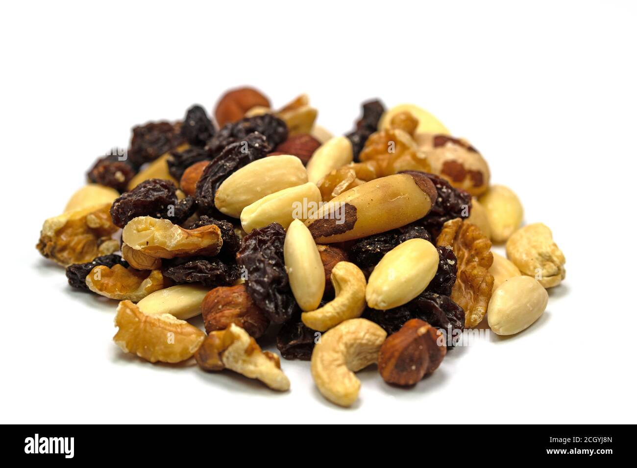A mix of nuts and raisins against a white background Stock Photo - Alamy