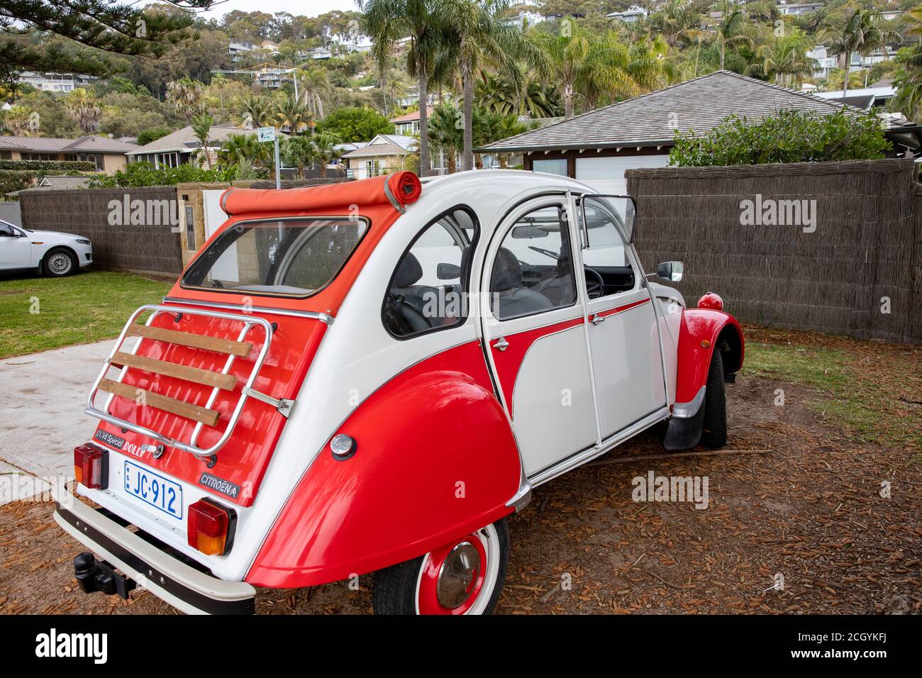 Citreon 2CV car in red and white colours parked at Palm beach in Sydney ...