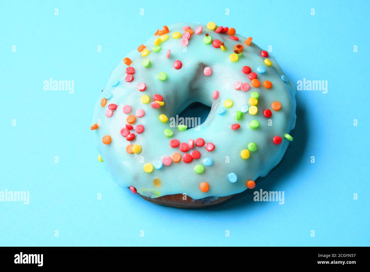 One blue color sweet donut on blue background with copy space Stock ...