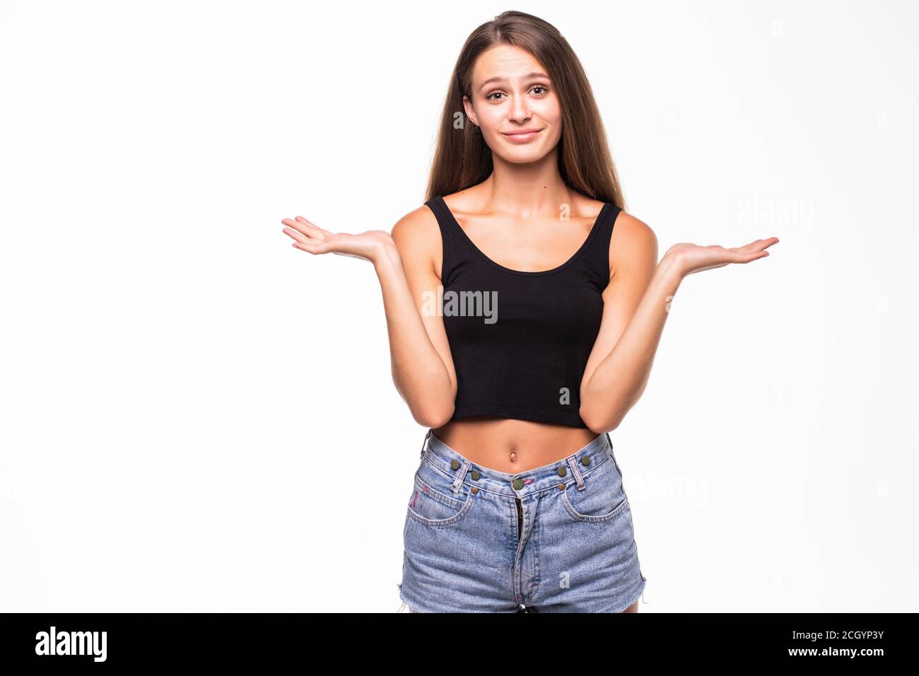 unsure woman with shrug and hands out gesturing uncertainty Stock Photo ...