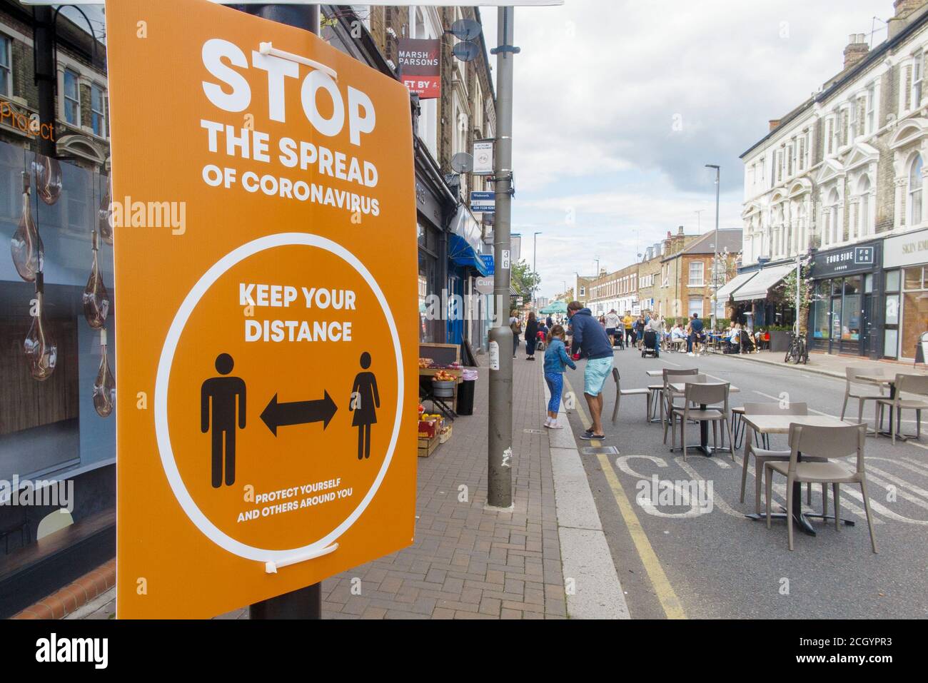 Keep Your Distance signs on Northcote Road, Clapham in London during ...
