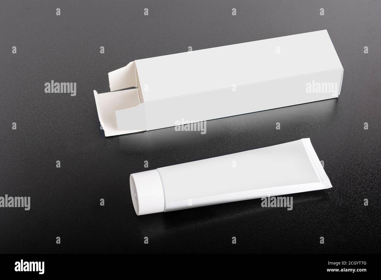 Rectangular box package mockup with tube on ground, editable mock-up ...