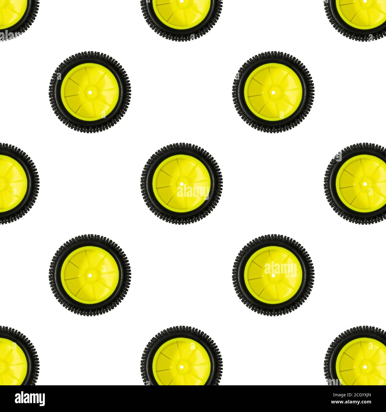 Close up view pattern of mini size yellow plast wheel with black tire ...