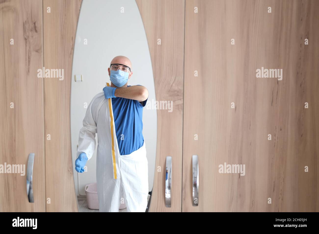 Young doctor wearing a protective suit. professional doctor Stock Photo ...