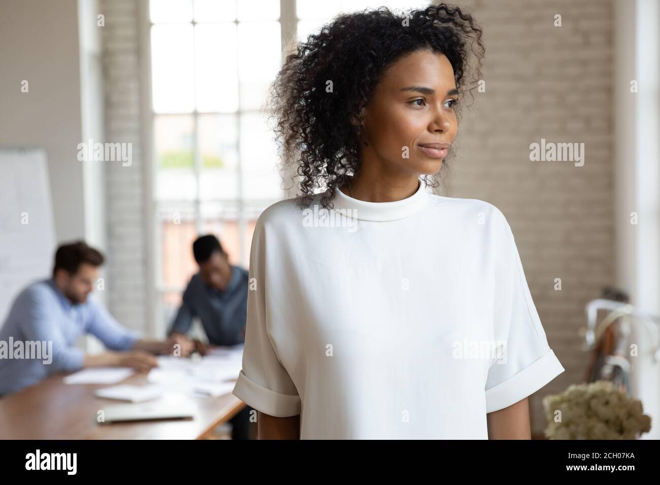 Pensive biracial woman look in distance thinking Stock Photo - Alamy