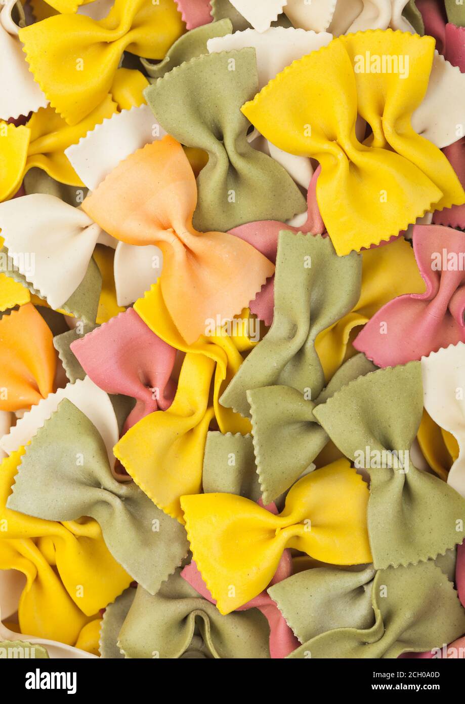 Farfalle multicolor italian luxury pasta as texture background. Top ...