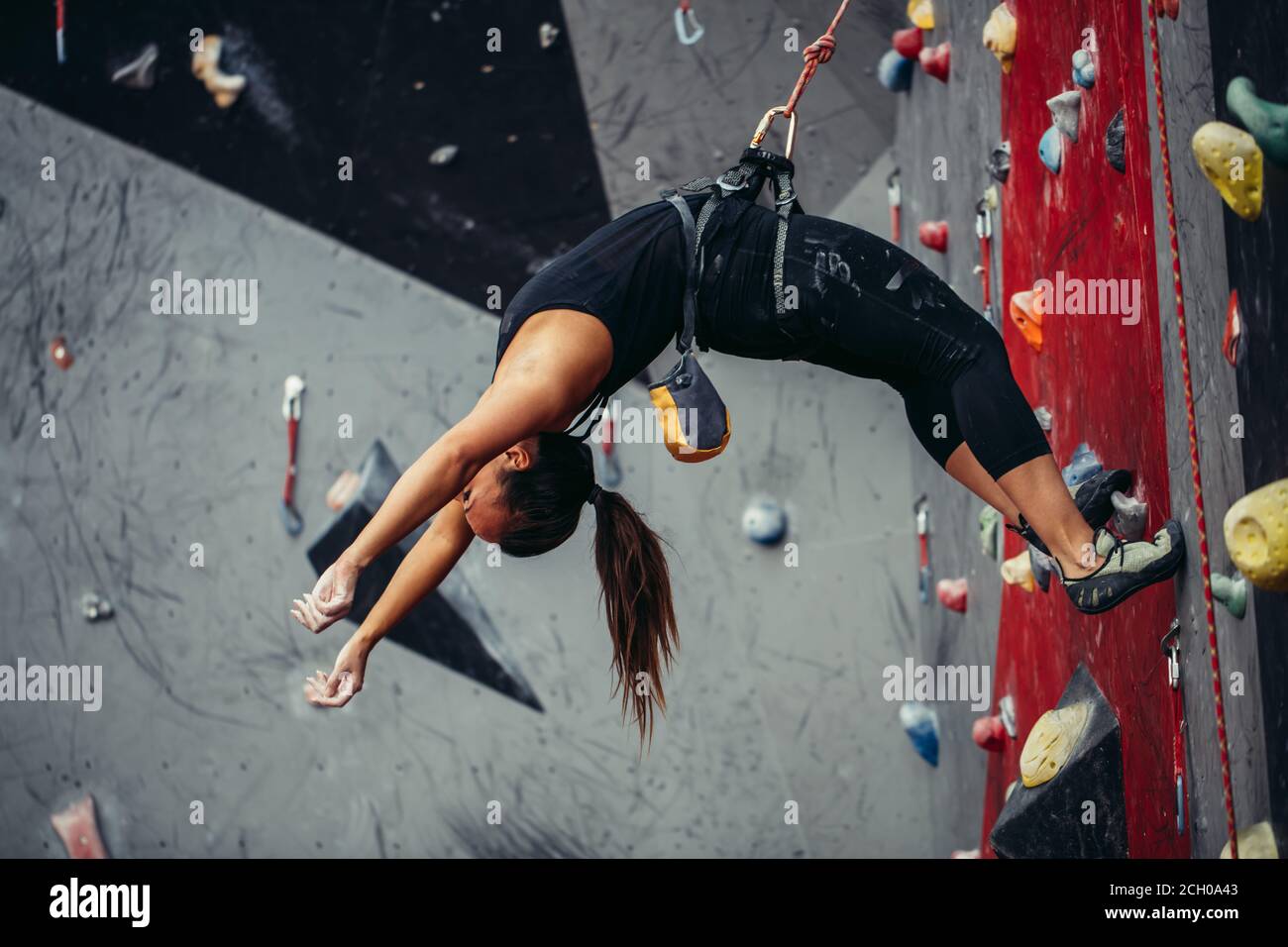 Female Climber In An Overhang On The Climbing Wall High Resolution ...