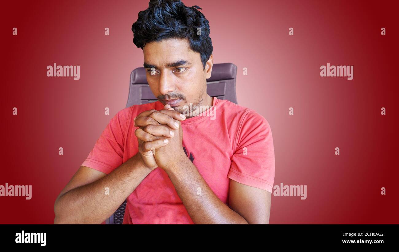 Man sitting on a wooden chair at home with handshake pose. man touching ...