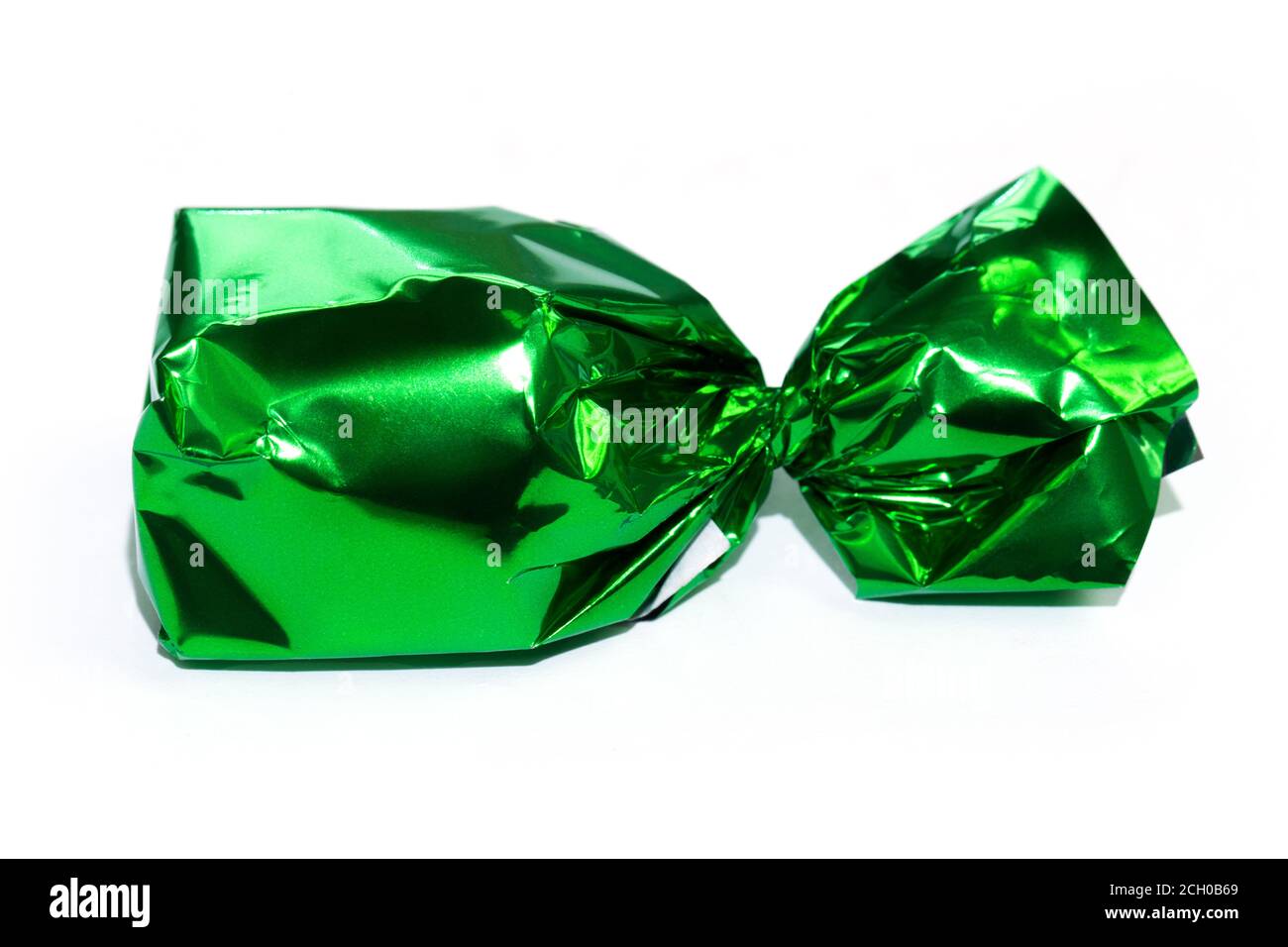 Green candy wrapped isolated on white Stock Photo - Alamy