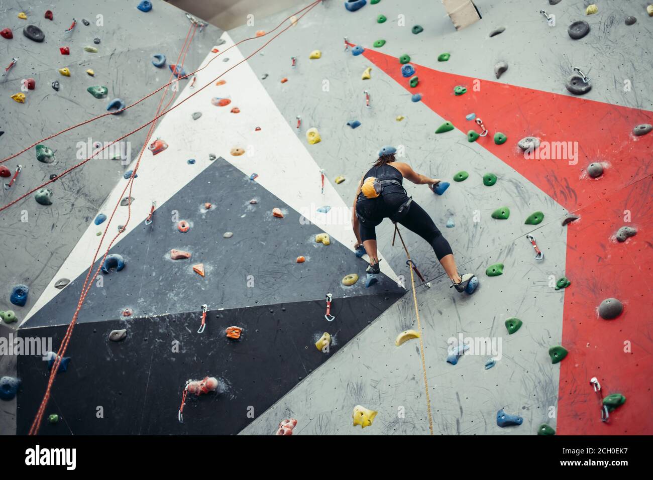 Attractive sporty woman making efforts for a big step up on an ...