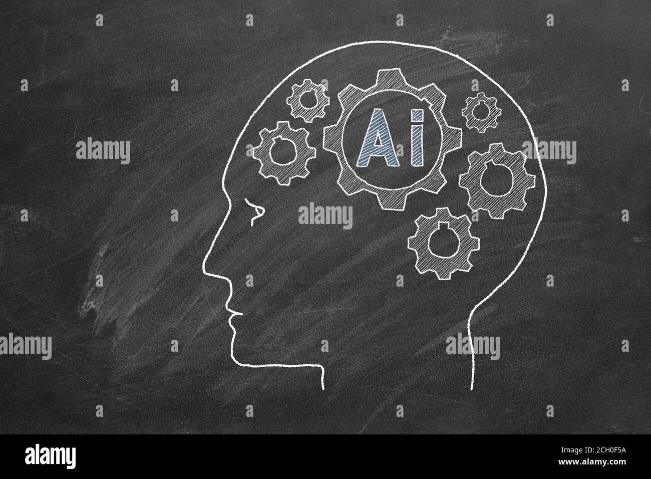 Human brain shape from gears inside of human head on blackboard ...