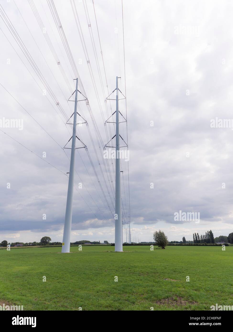 Modern electric power lines, The Netherlands Stock Photo - Alamy