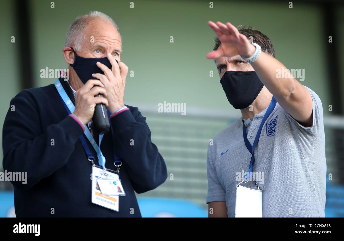 England Women's manager Phil Neville (right) speaks with Manchester ...