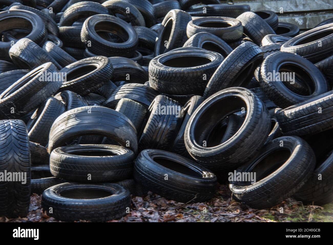 large pile of used tires for recycling Stock Photo - Alamy