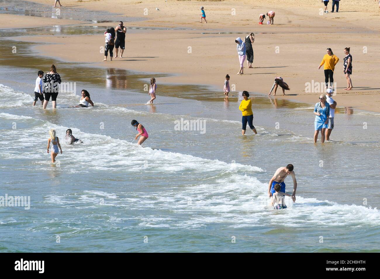People enjoying the Autumn sunshine on Bournemouth beach Stock Photo ...