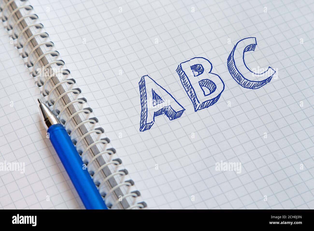Text ABC handwritten on sheet of notebook Stock Photo - Alamy