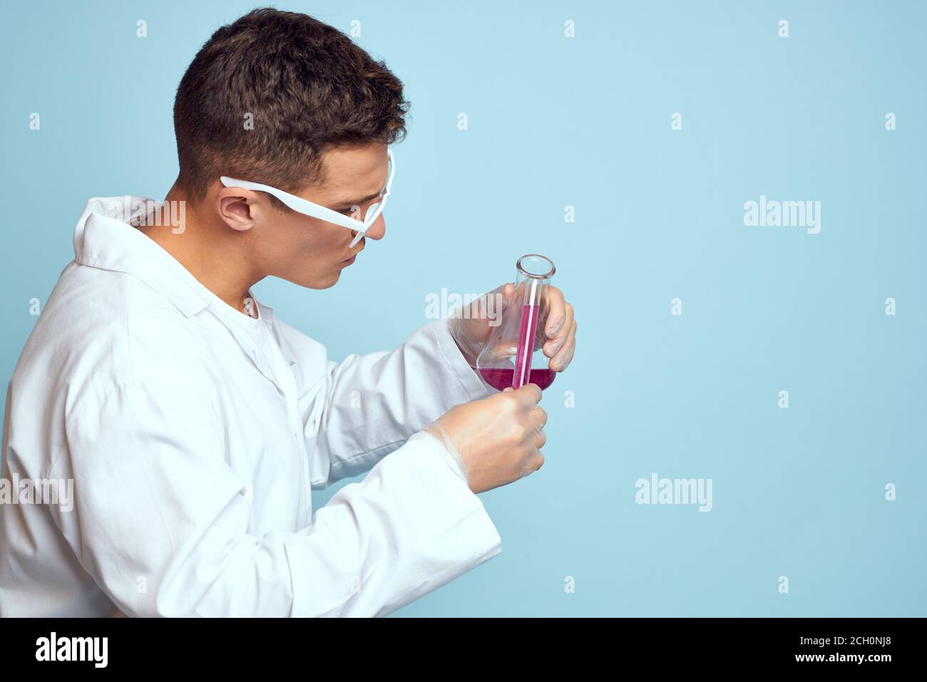 man holding flasks colorful liquid chemical laboratory model wearing ...