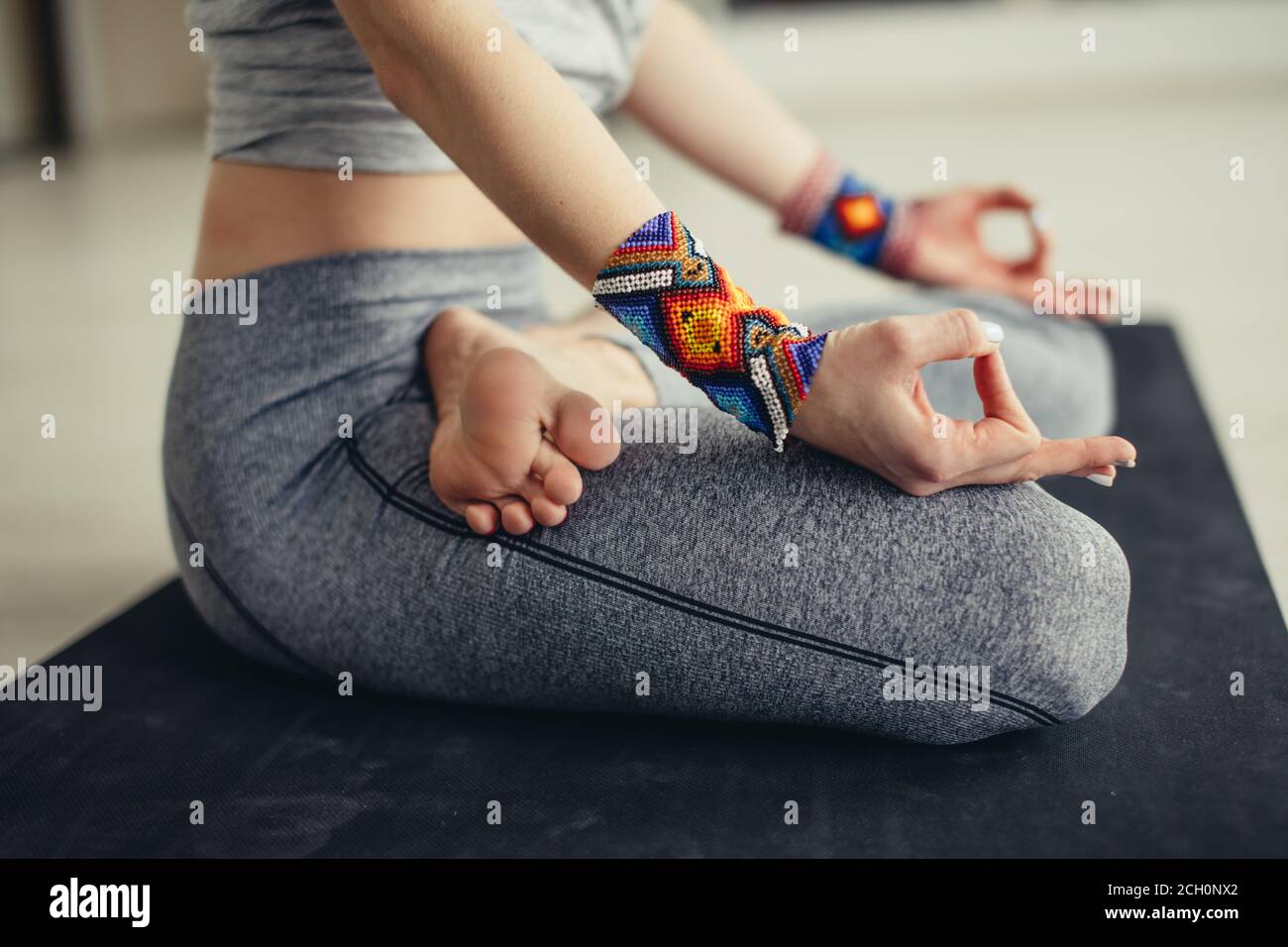 Group of young sporty people practicing yoga lesson with instructor ...