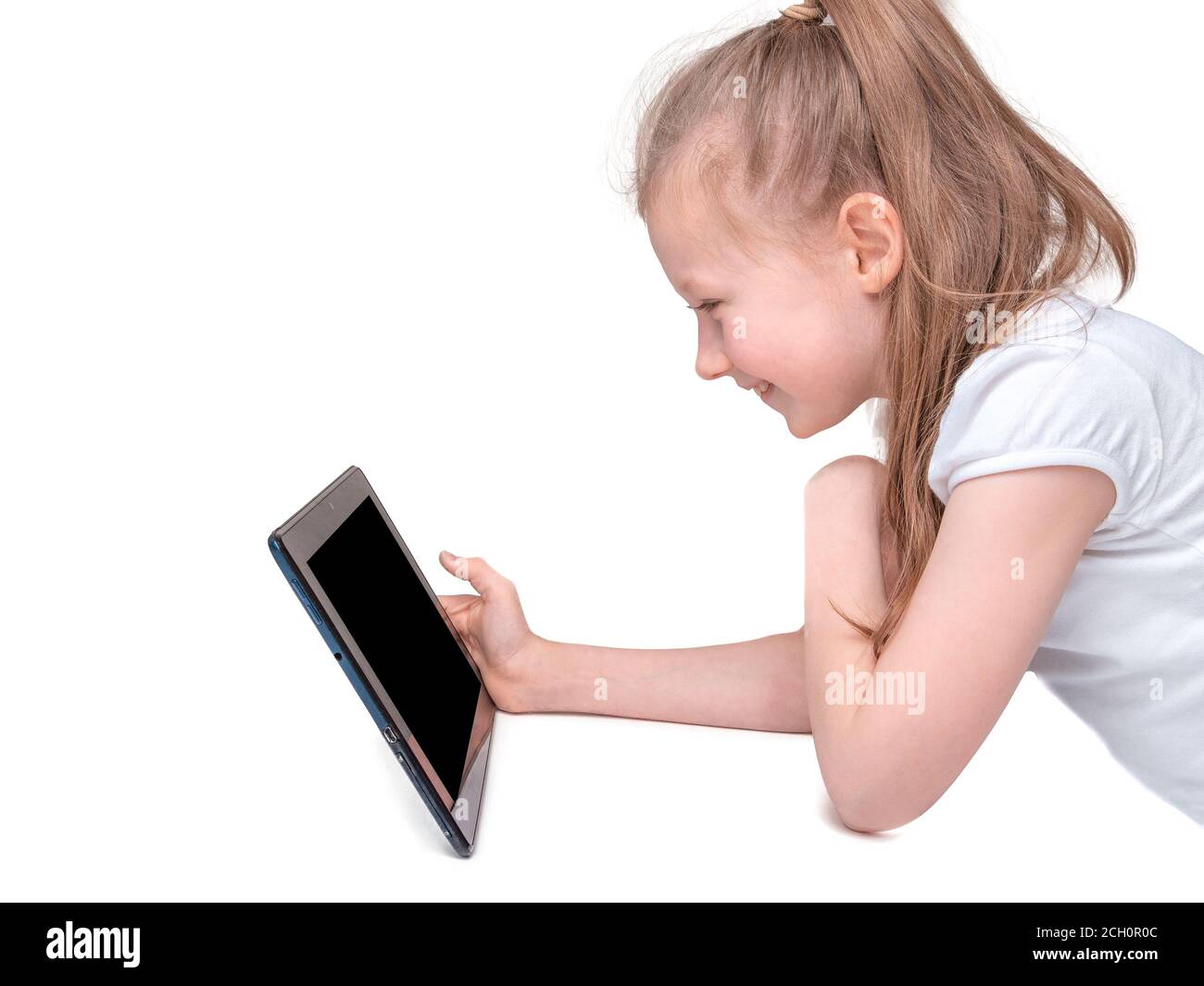 Little girl using Tablet PC at home. Education, science, technology ...
