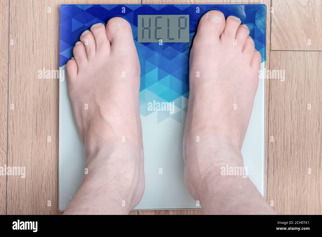 Fat man on scale hi-res stock photography and images - Alamy
