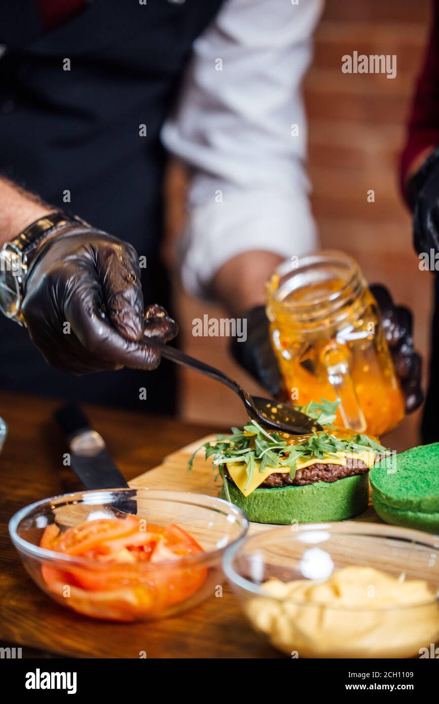 Chef making beef burgers outdoor on open kitchen international food ...