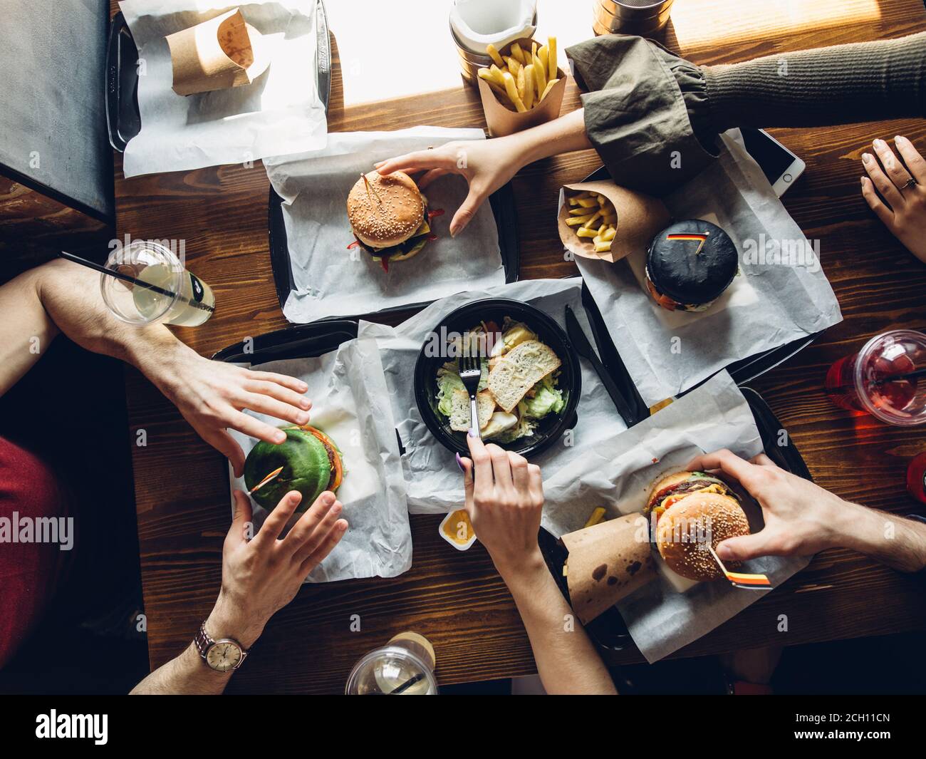 Friendship, holidays, fast food and celebration concept - cropped human ...