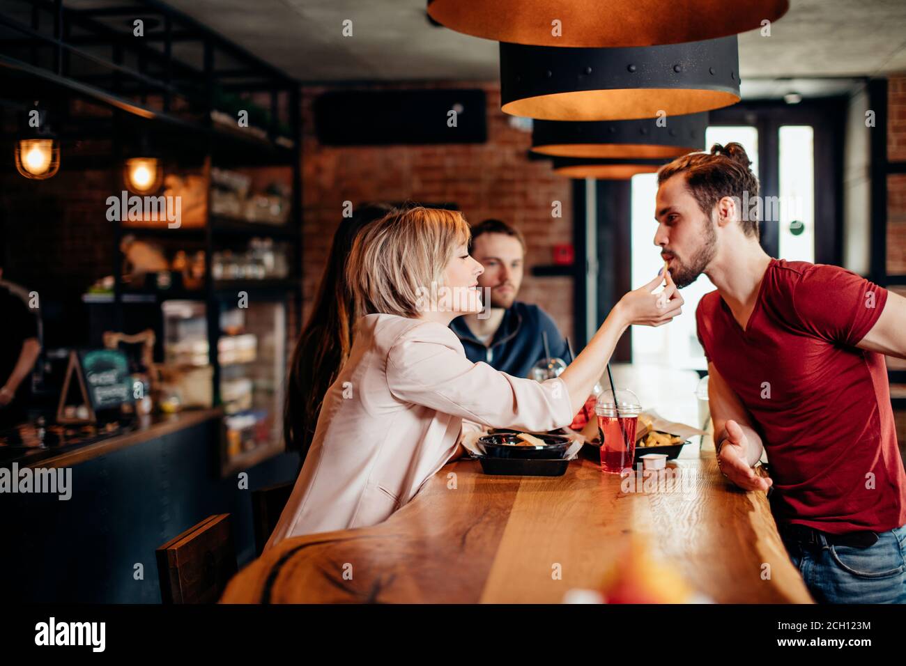 Woman offering help man sitting hi-res stock photography and images - Alamy