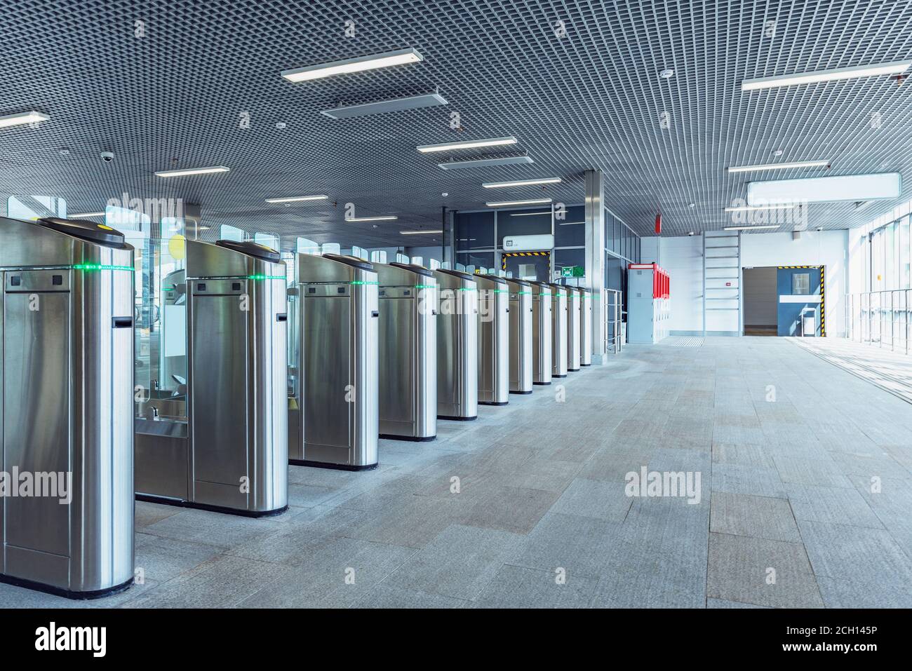 Turnstiles with electronic card readers on the station platform Stock ...