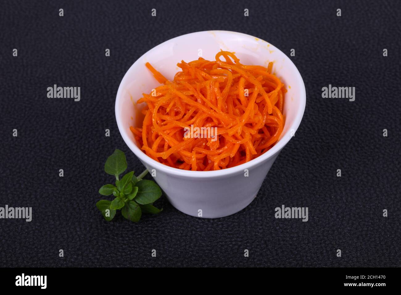 Korean cattot snack salad in the bowl served basil leaves Stock Photo ...