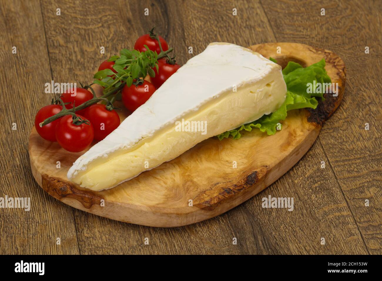 Brie cheese triangle served salad leaves Stock Photo - Alamy