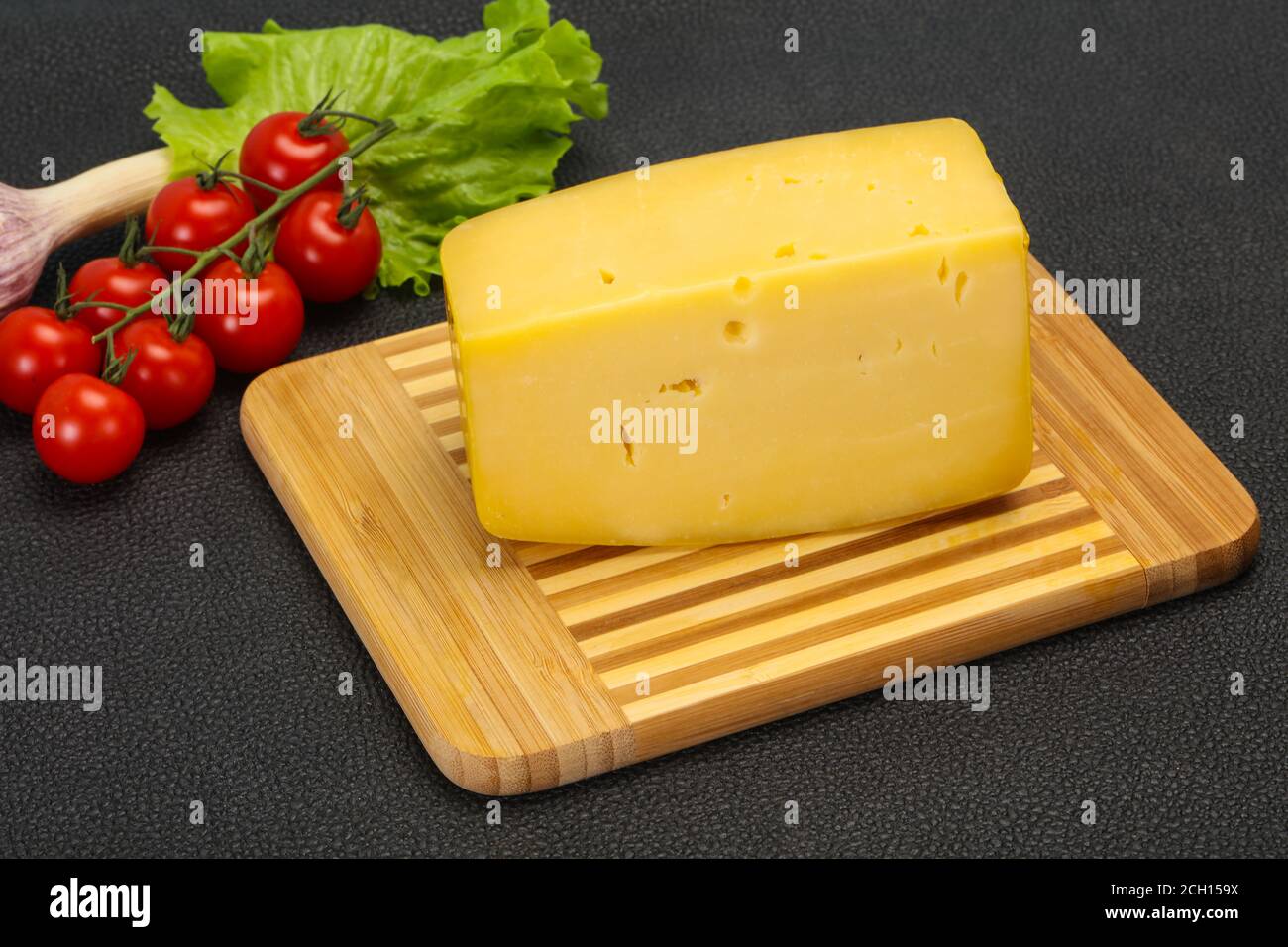 Swiss Hard yellow tasty cheese brick Stock Photo - Alamy