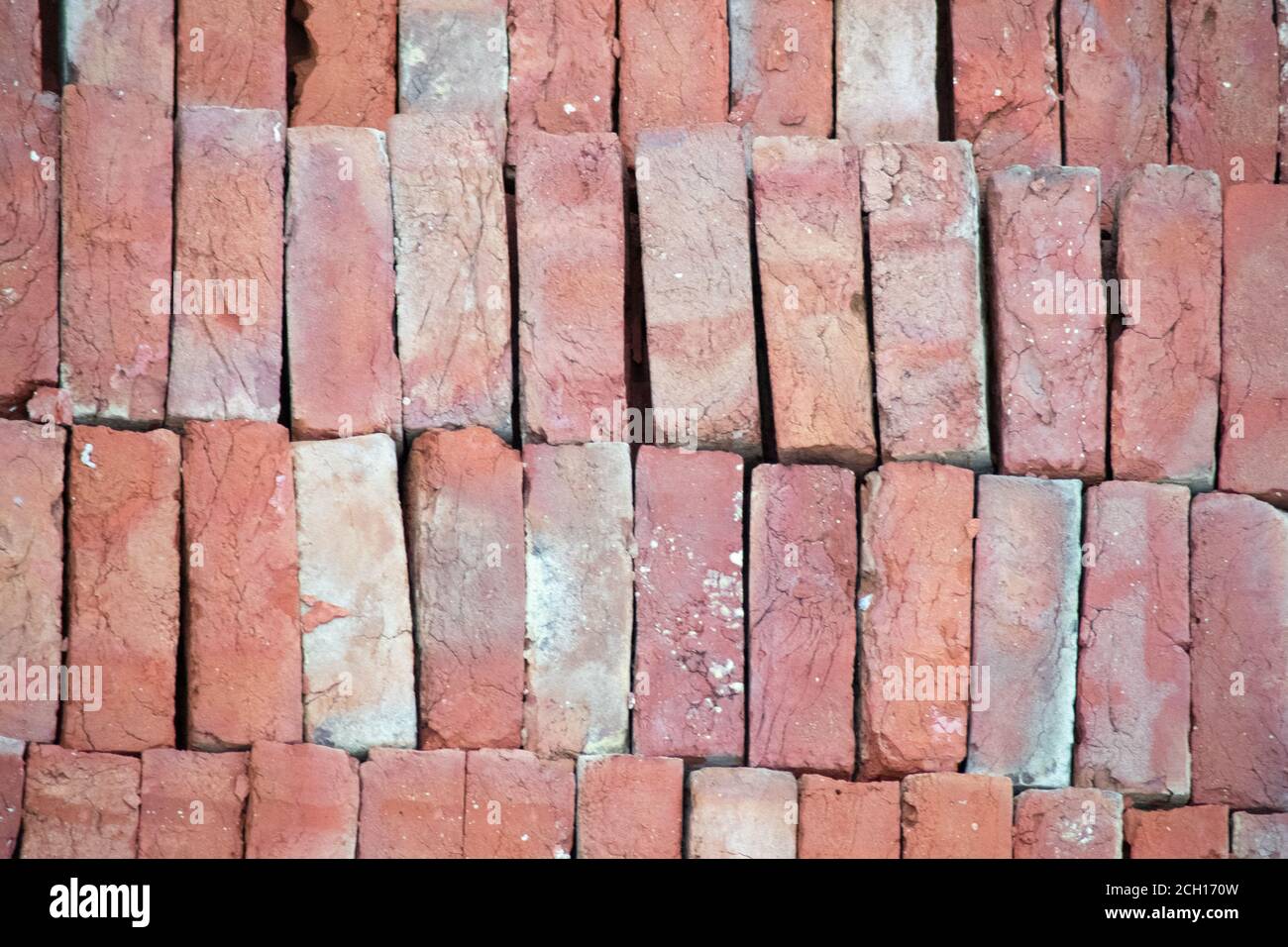 Pile of bricks placed on the ground, showing the pattern and the ...